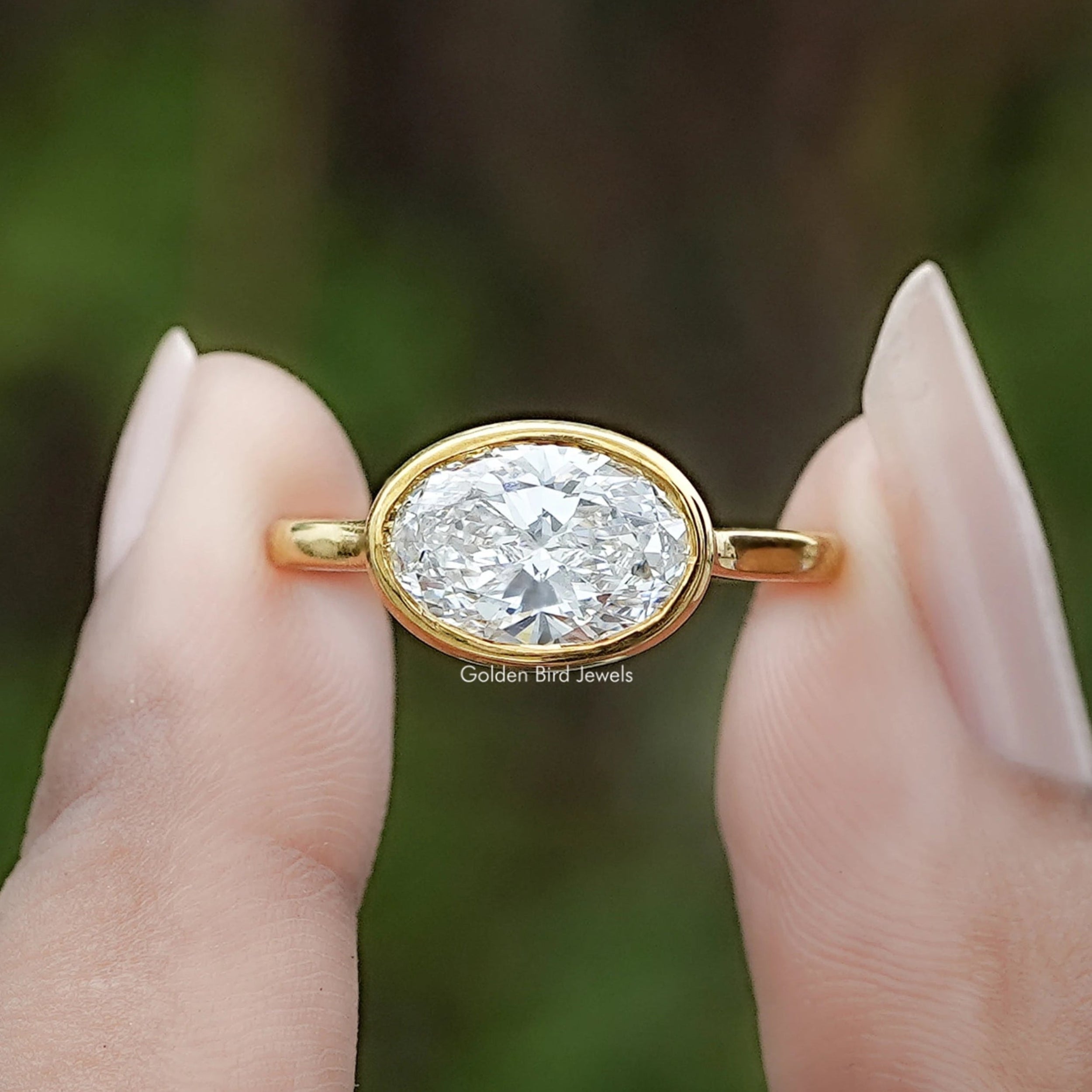 Bezel Set Oval Cut East West Ring