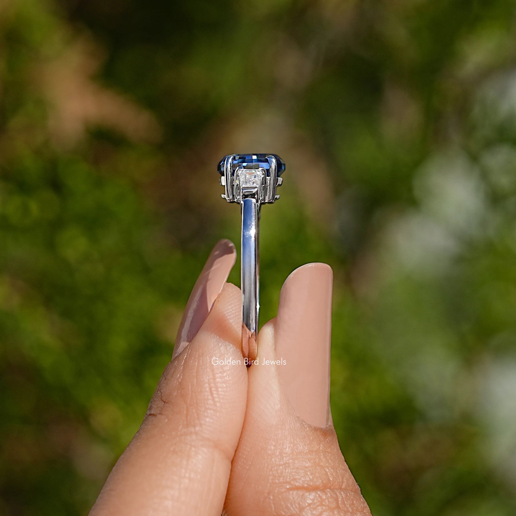 Blue Step Cut Oval Three Stone Ring